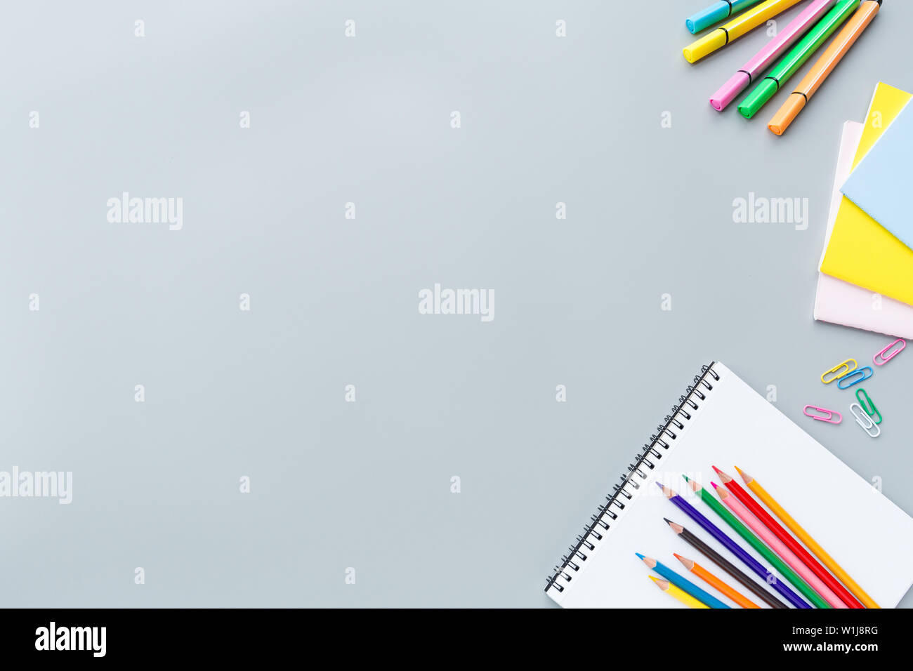 Orange back to school flat lay with bright stationery. School supplies ...