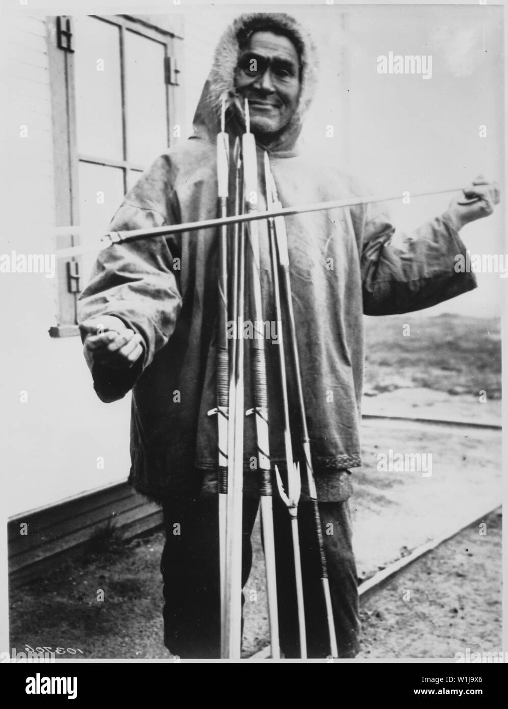 An eskimo spear and lancemaker with his wares hi-res stock photography ...