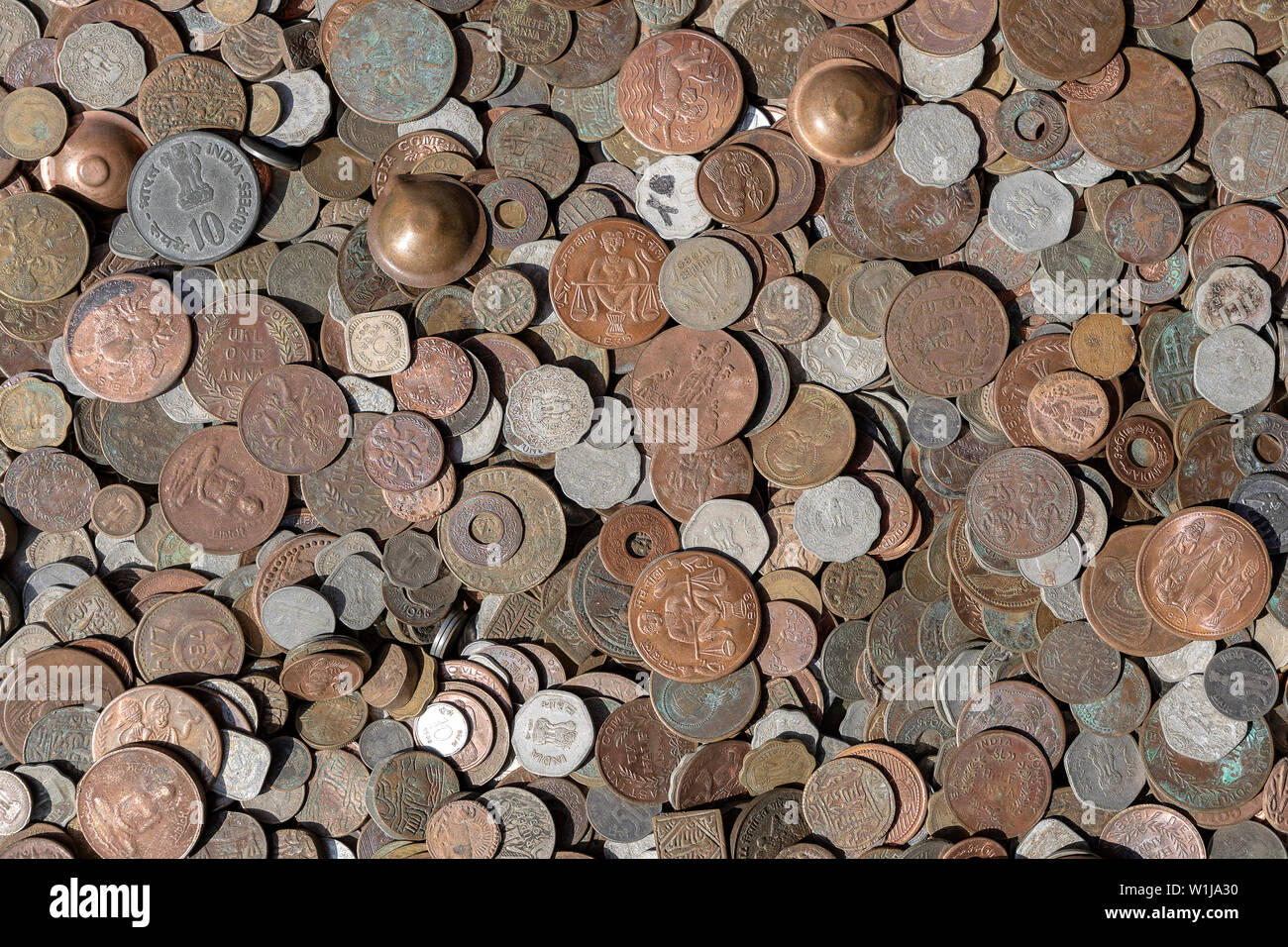 Old vintage fake coins background for sale to tourists in the Indian ...