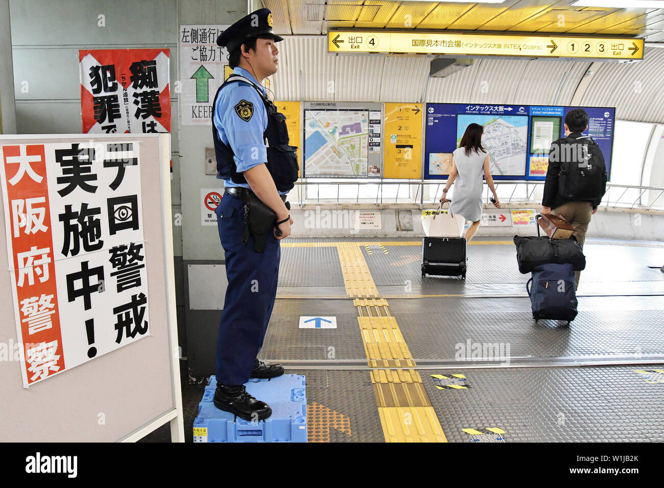 Police officer stand guard around the Intex Osaka in Osaka, Japan on ...
