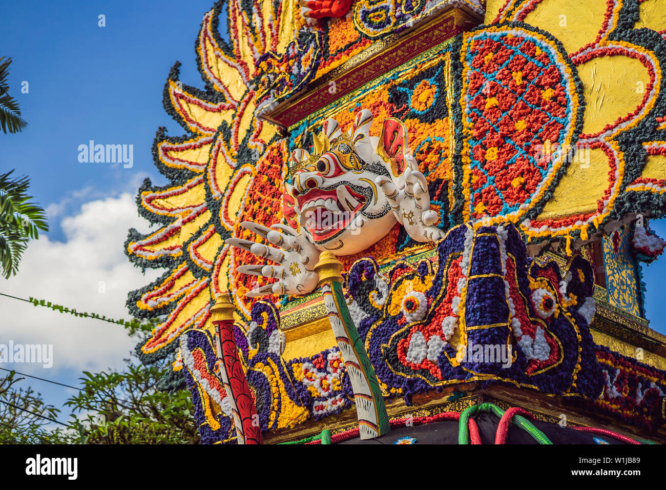 Bade cremation tower with traditional balinese sculptures of demons and ...