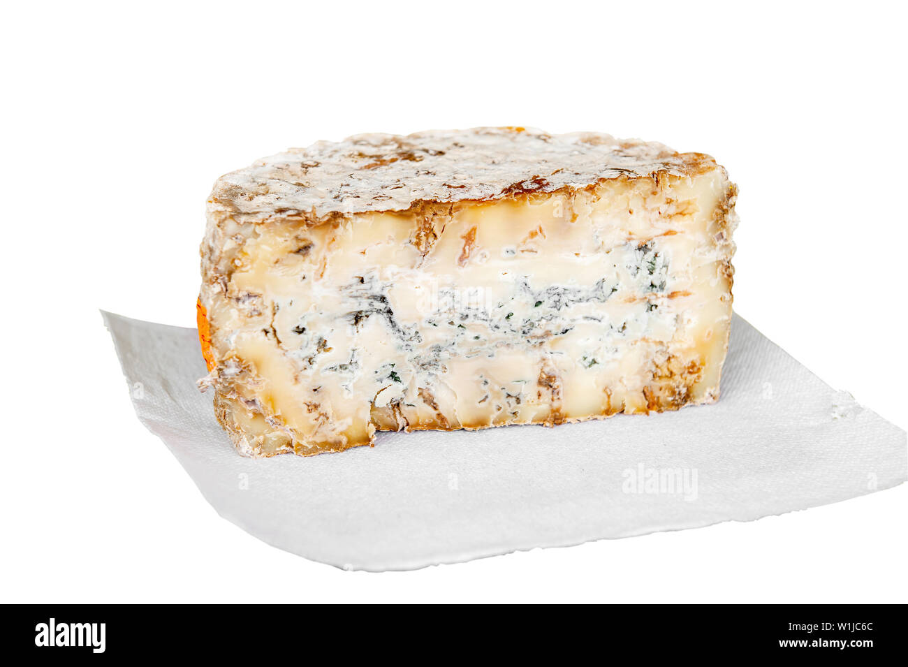 A slice of blue aged delicatessen Stilton cheese on a piece of white ...