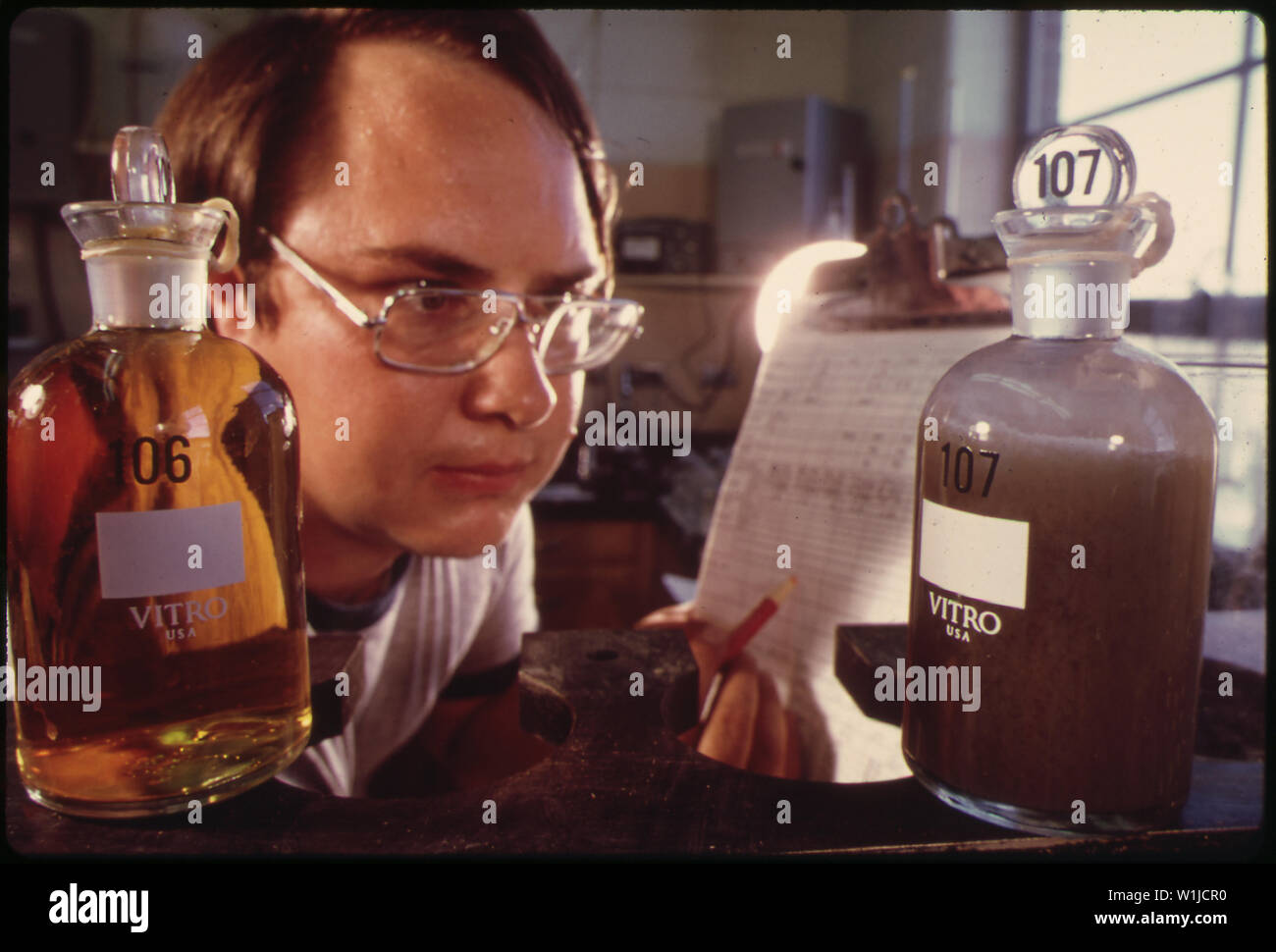 TECHNICIAN AT SEWAGE TREATMENT PLANT PERFORMS A BIOLOGICAL OXYGEN ...