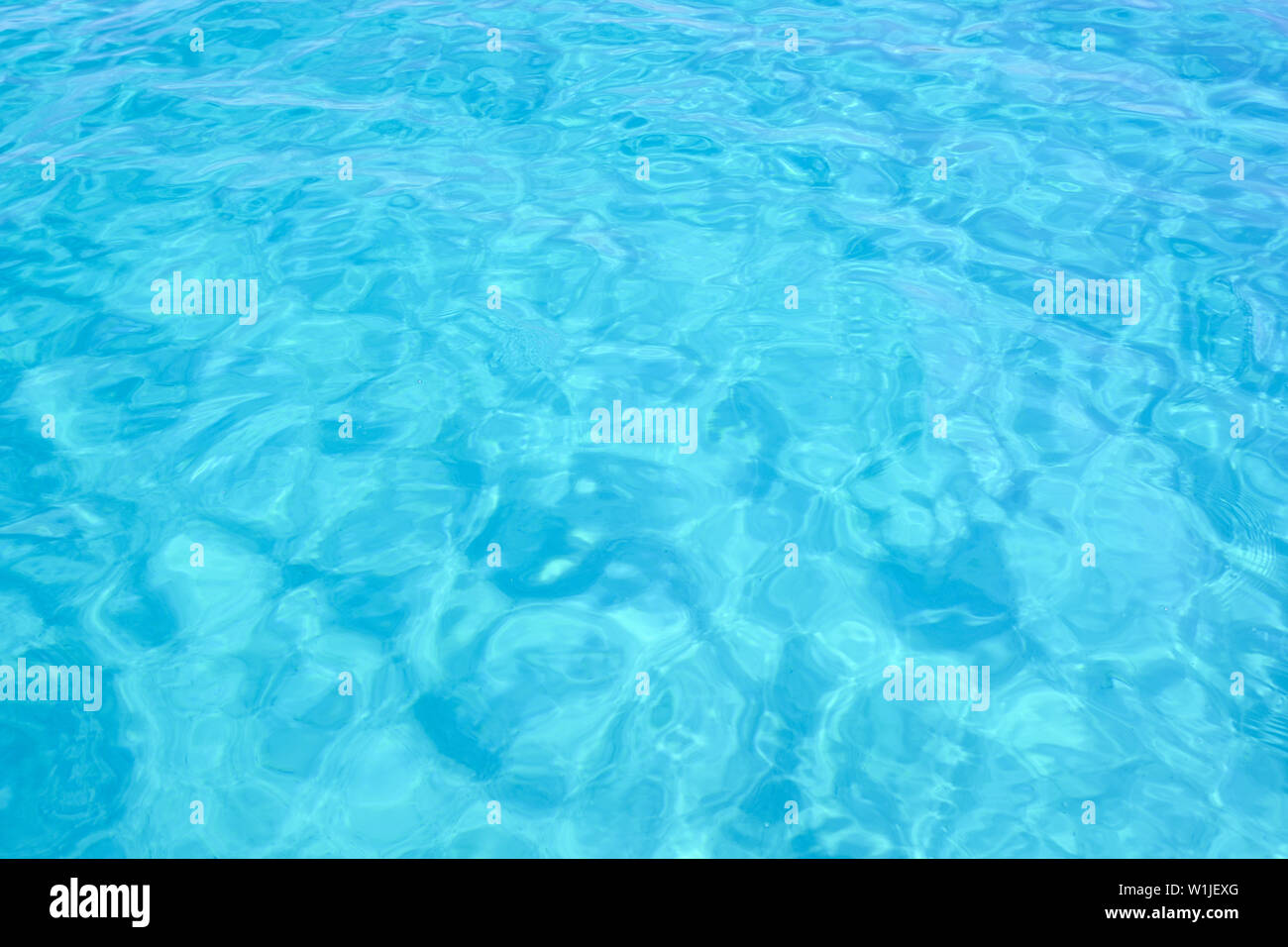 Close-up view of a transparent turquoise sea water that forms a natural ...