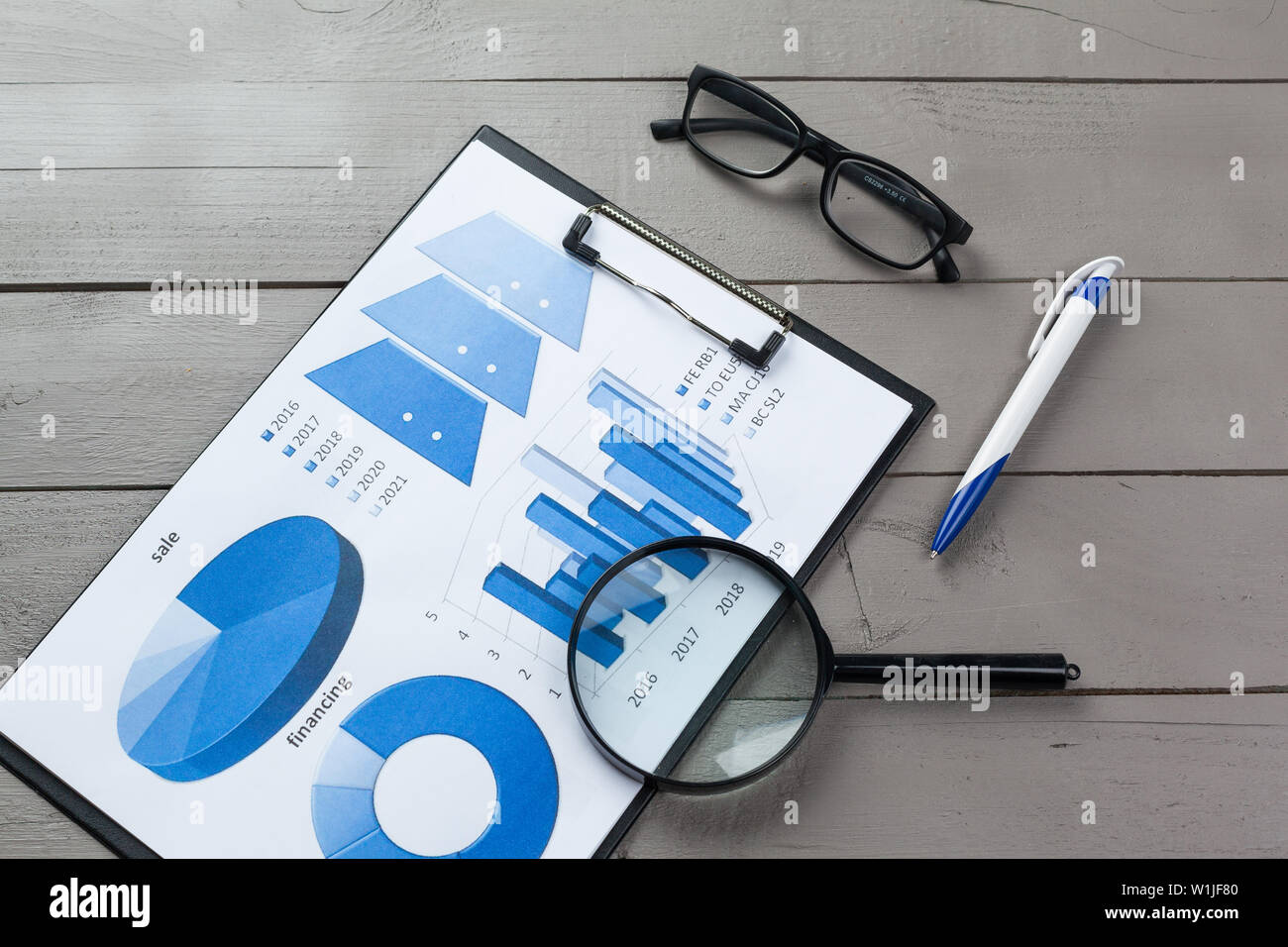 Financial paper charts and graphs on the table Stock Photo - Alamy