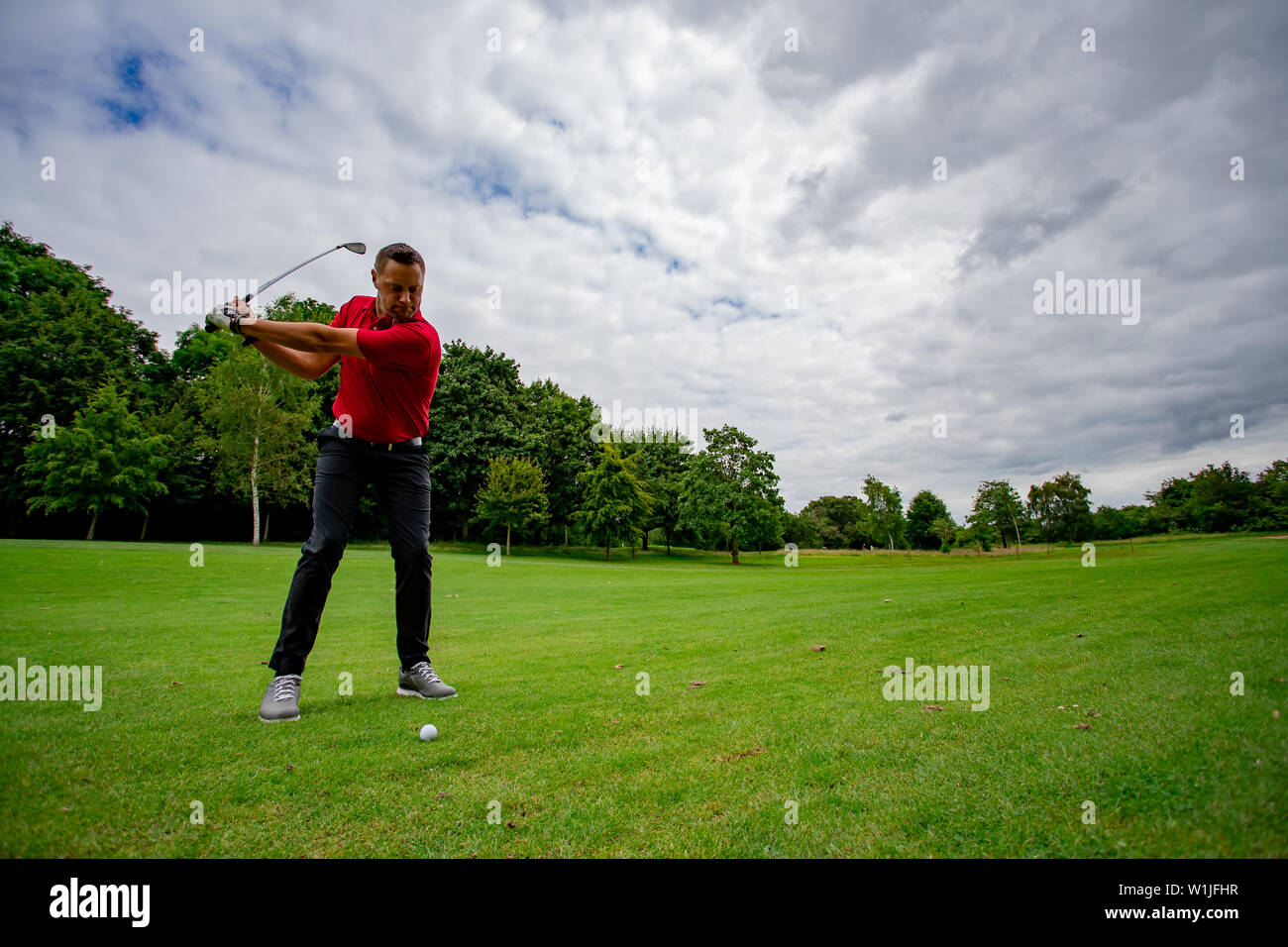 Golfer addressing the ball hi-res stock photography and images - Alamy