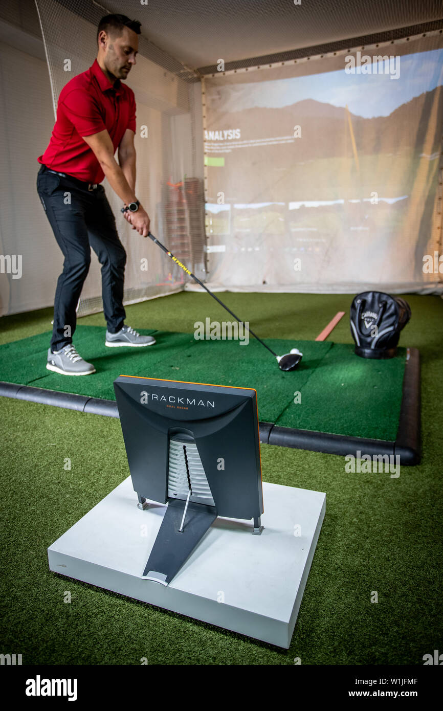 A professional golfer uses Trackman analysis to improve his play Stock ...