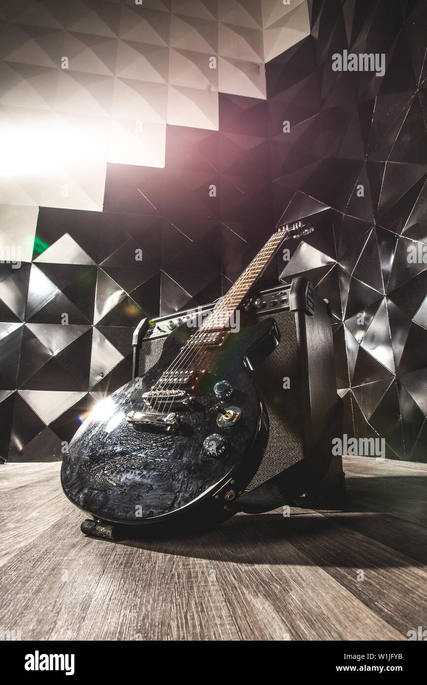 electric guitar and classic amplifier on a dark background Stock Photo ...