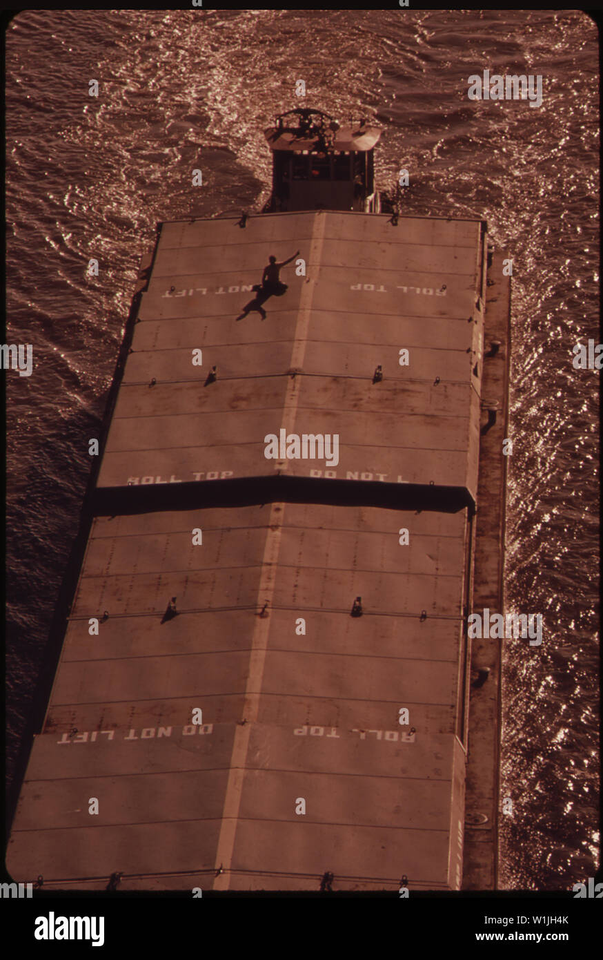 TOWBOAT PUSHES ENORMOUS BARGE UP THE HOUSTON SHIP CHANNEL MAN ON ROOF ...
