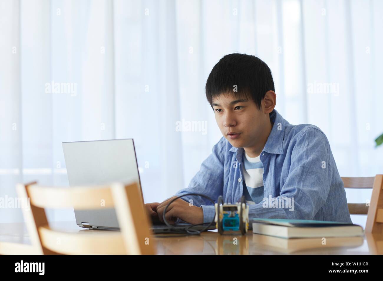 Japanese teenager studying programming Stock Photo - Alamy