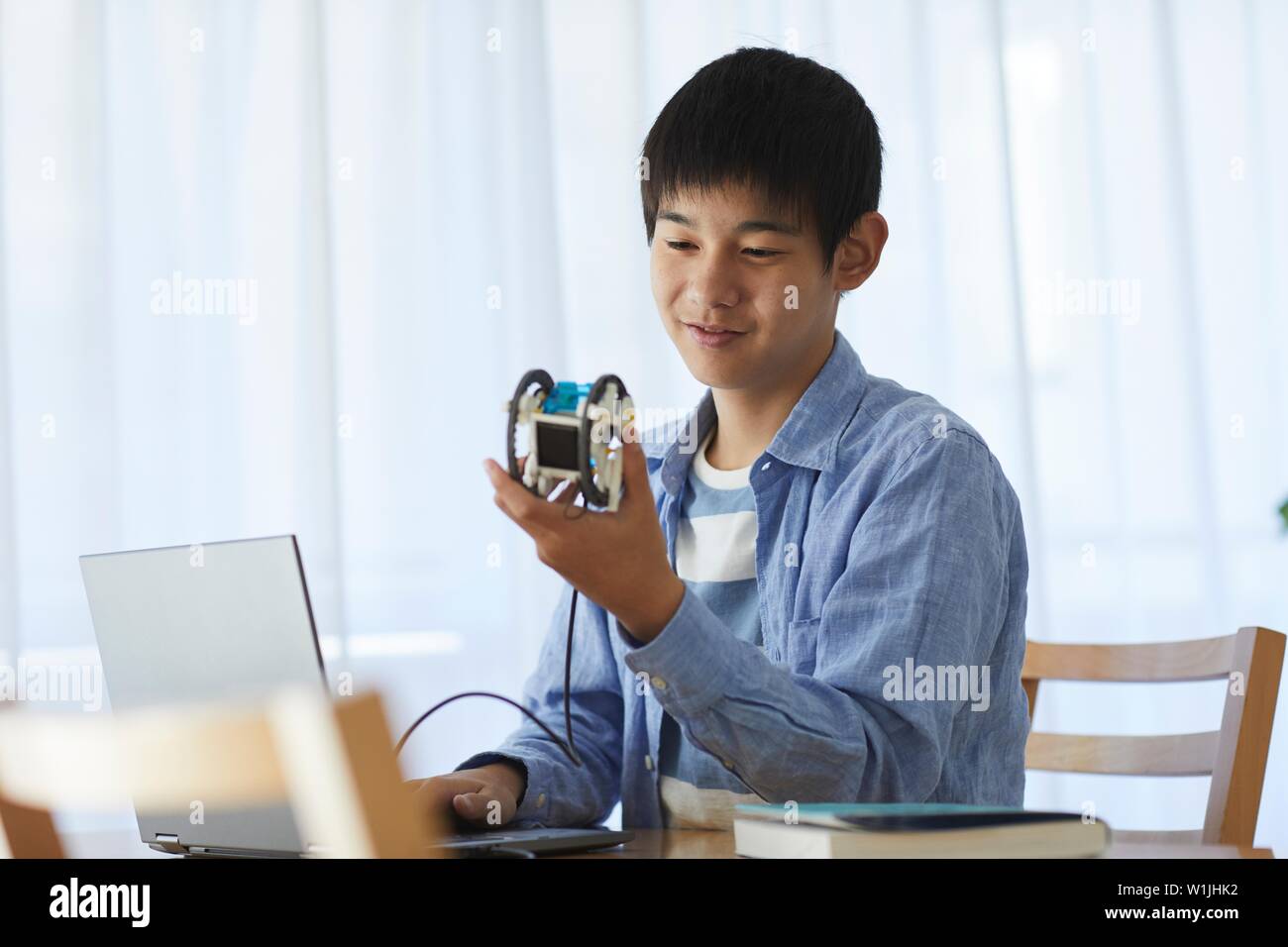 Japanese teenager studying programming Stock Photo - Alamy