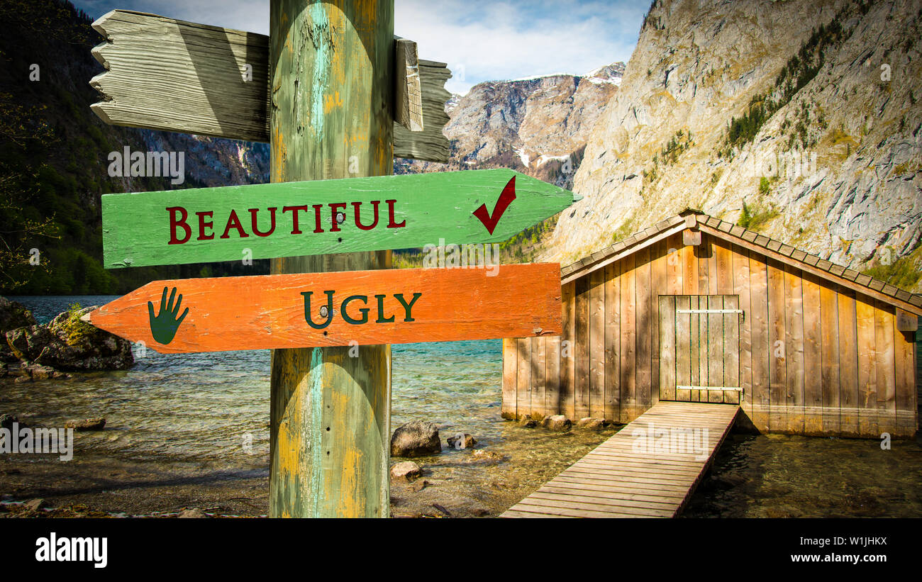 Street Sign the Direction Way to Beautiful versus Ugly Stock Photo - Alamy