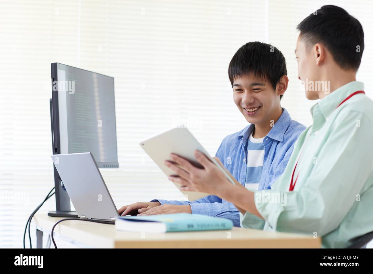 Japanese teenager studying programming Stock Photo - Alamy
