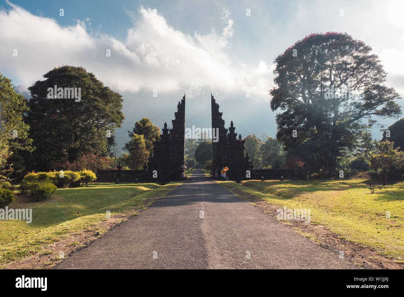 Ancient bali culture gate with shining on pathway in garden Stock Photo ...
