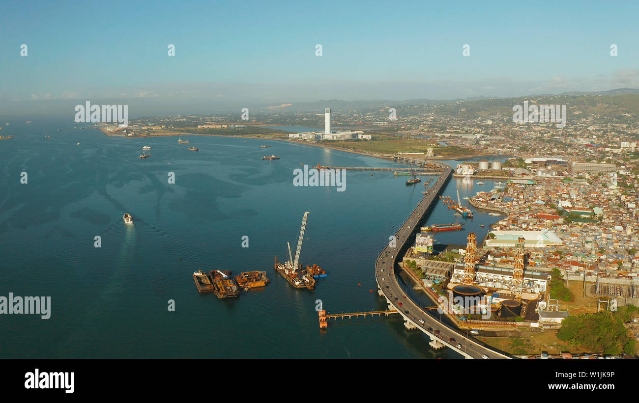 City of Cebu top view, the port in the harbor and cargo ships and a ...