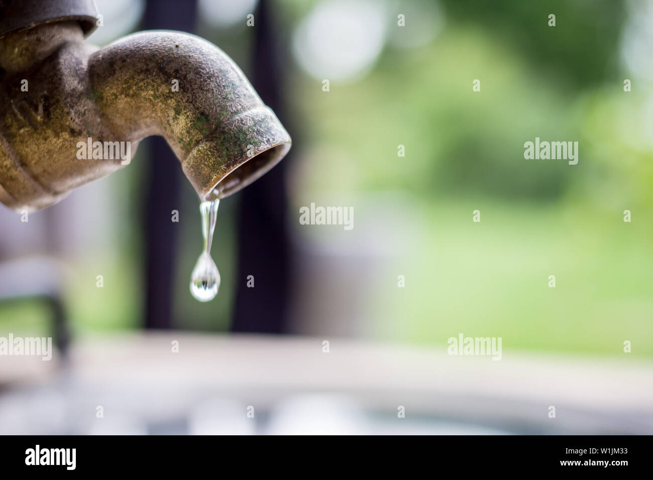 old rusty tap leaking water Stock Photo - Alamy