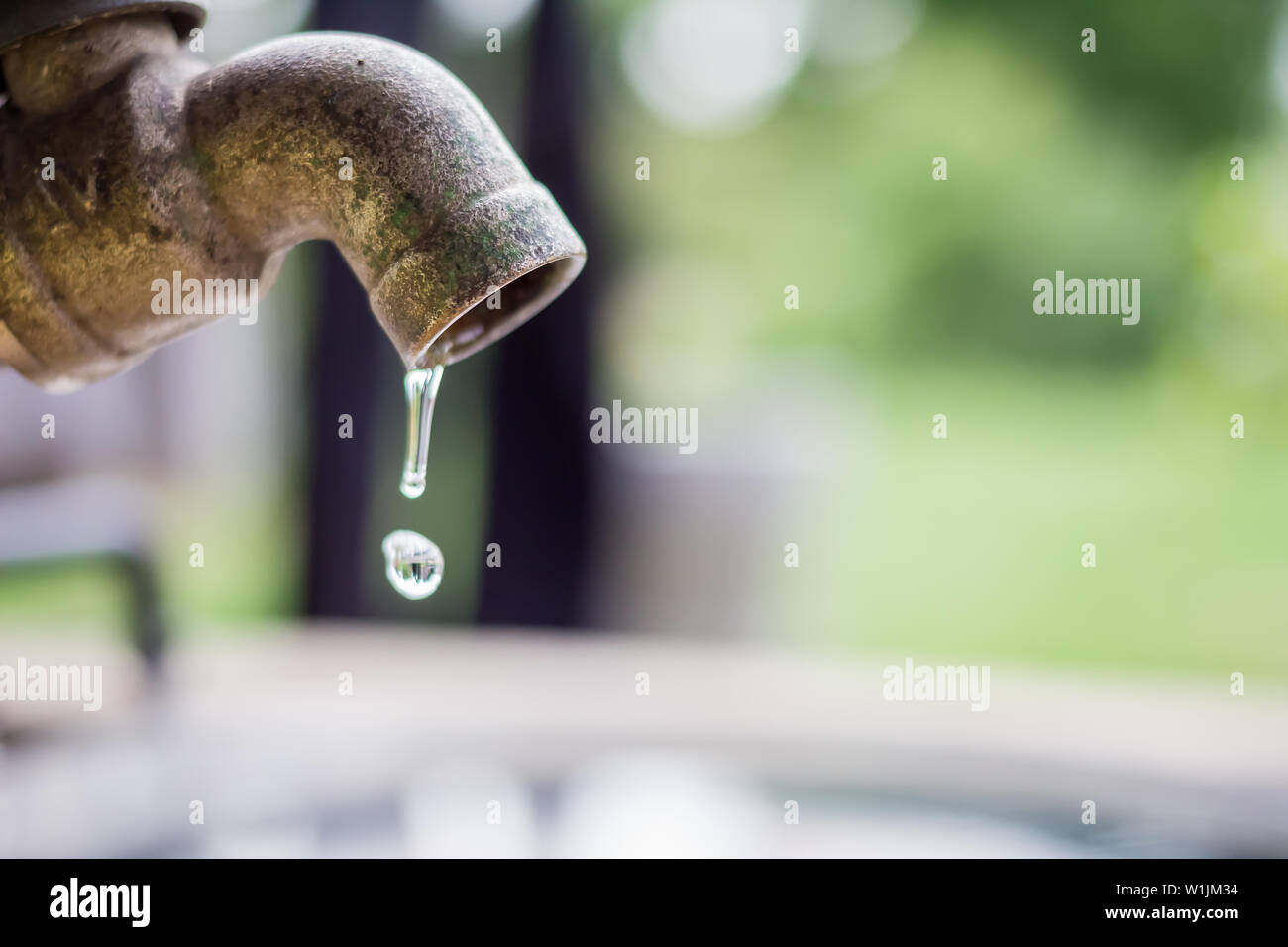 old rusty tap leaking water Stock Photo - Alamy