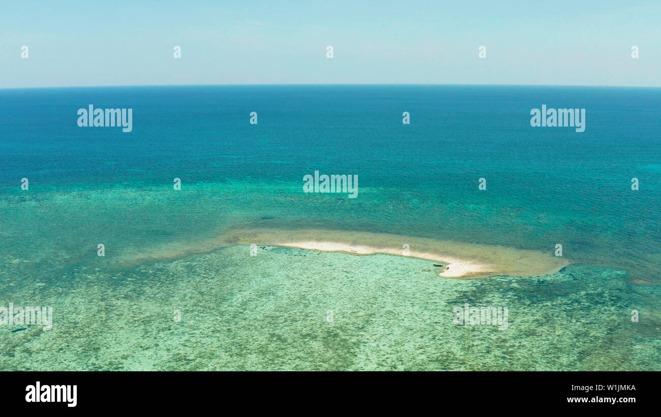 Sand bar among coral reefs in turquoise atoll water, top view. Summer ...
