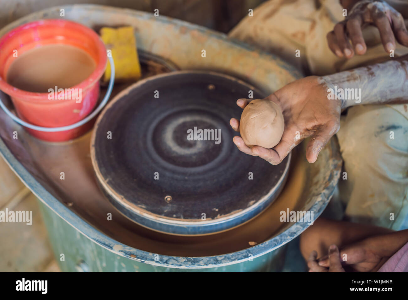 Boy doing ceramic pot in pottery workshop Stock Photo - Alamy
