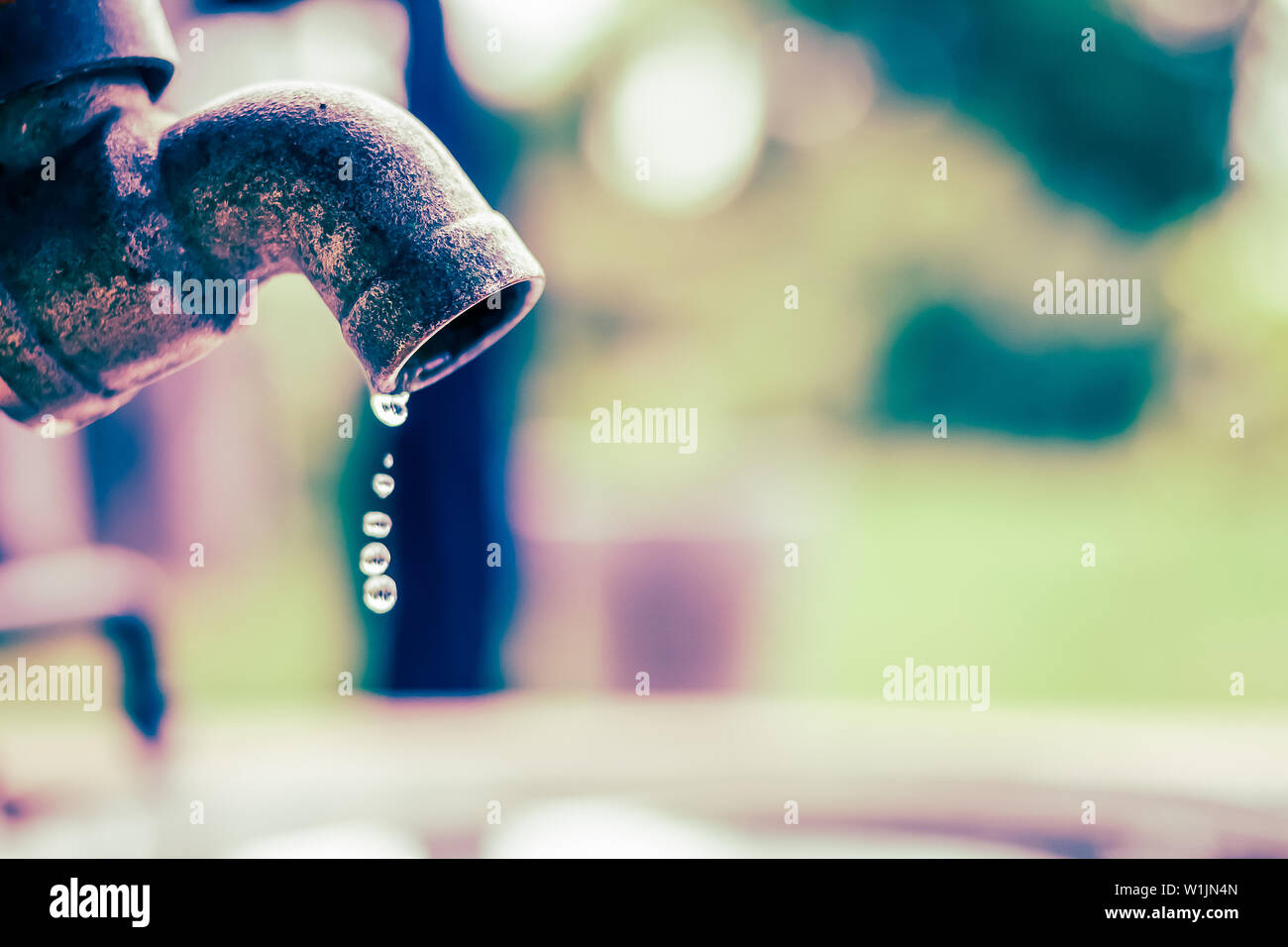 old rusty tap leaking water vintage style Stock Photo - Alamy