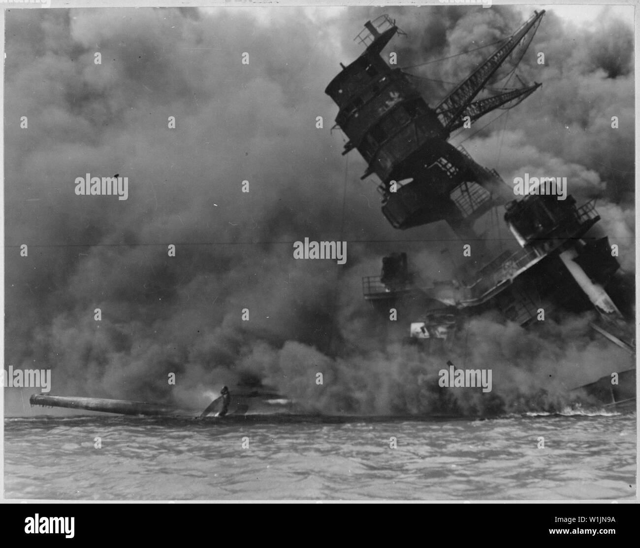The USS ARIZONA burning after the Japanese attack on Pearl Harbor ...