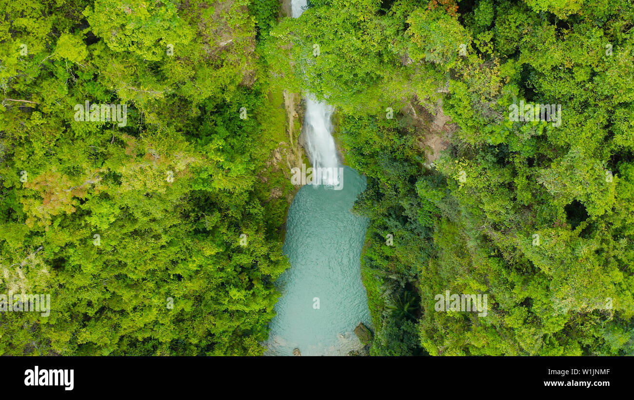 Waterfall in the rainforest jungle from above. Tropical Mantayupan ...