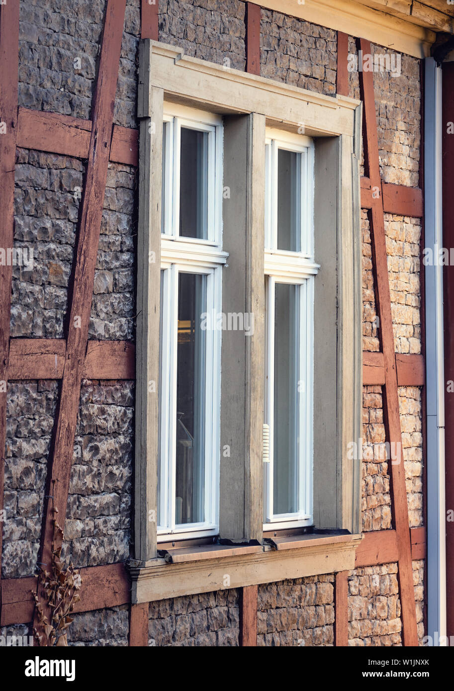 Big window on an old historical sandstone facade building Stock Photo ...