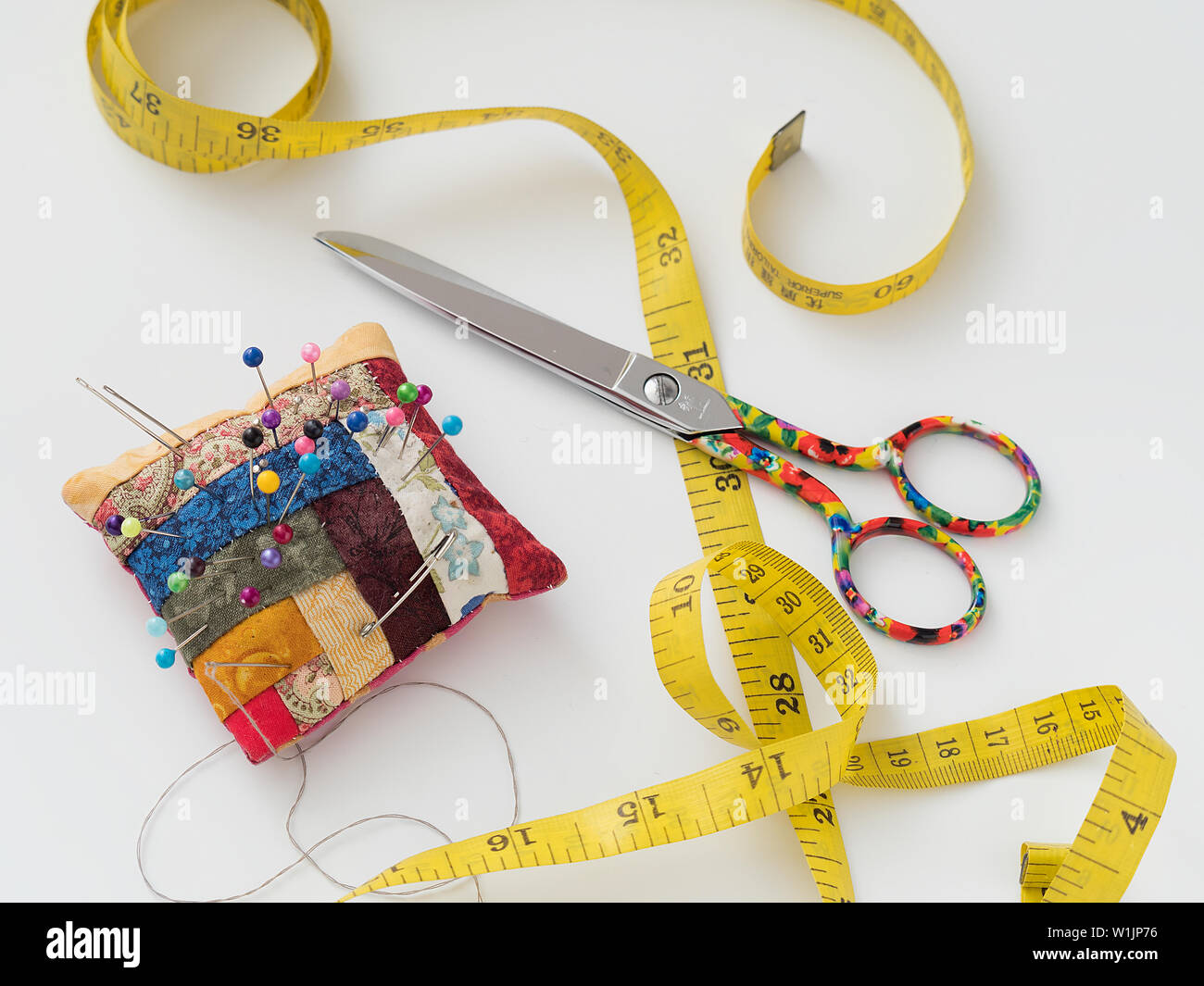 basic sewing set on white background Stock Photo - Alamy