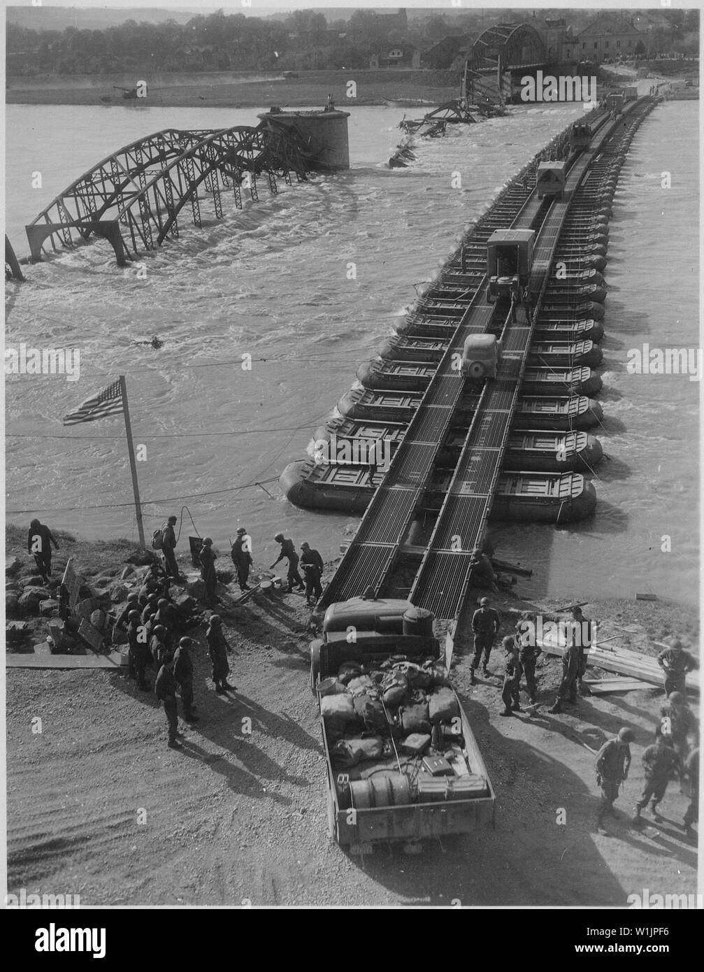 The war over, German soldiers here are crossing a pontoon bridge from ...