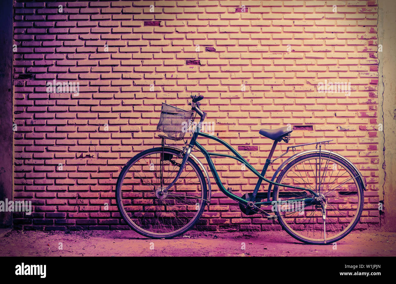 Old rusty vintage bicycle near the concrete wall Stock Photo - Alamy
