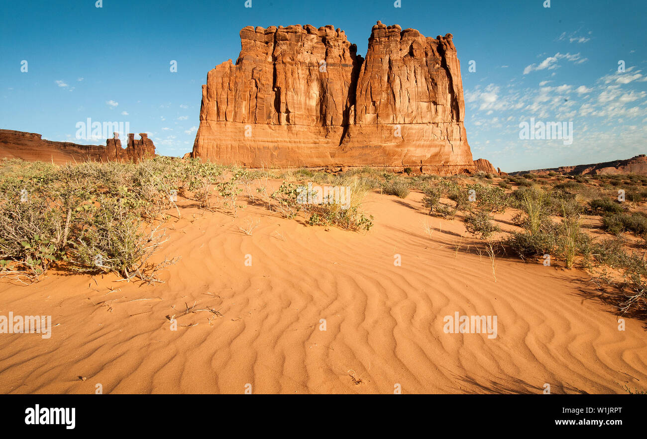 Rippling sand leads to Courthouse Towers in Arches National Park near ...