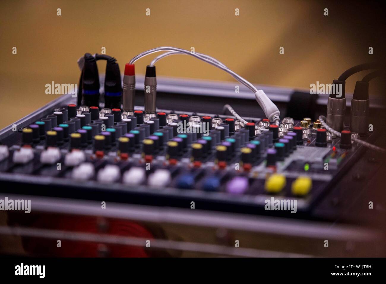 a small soundboard with dials and sliders and plugs with wires Stock ...