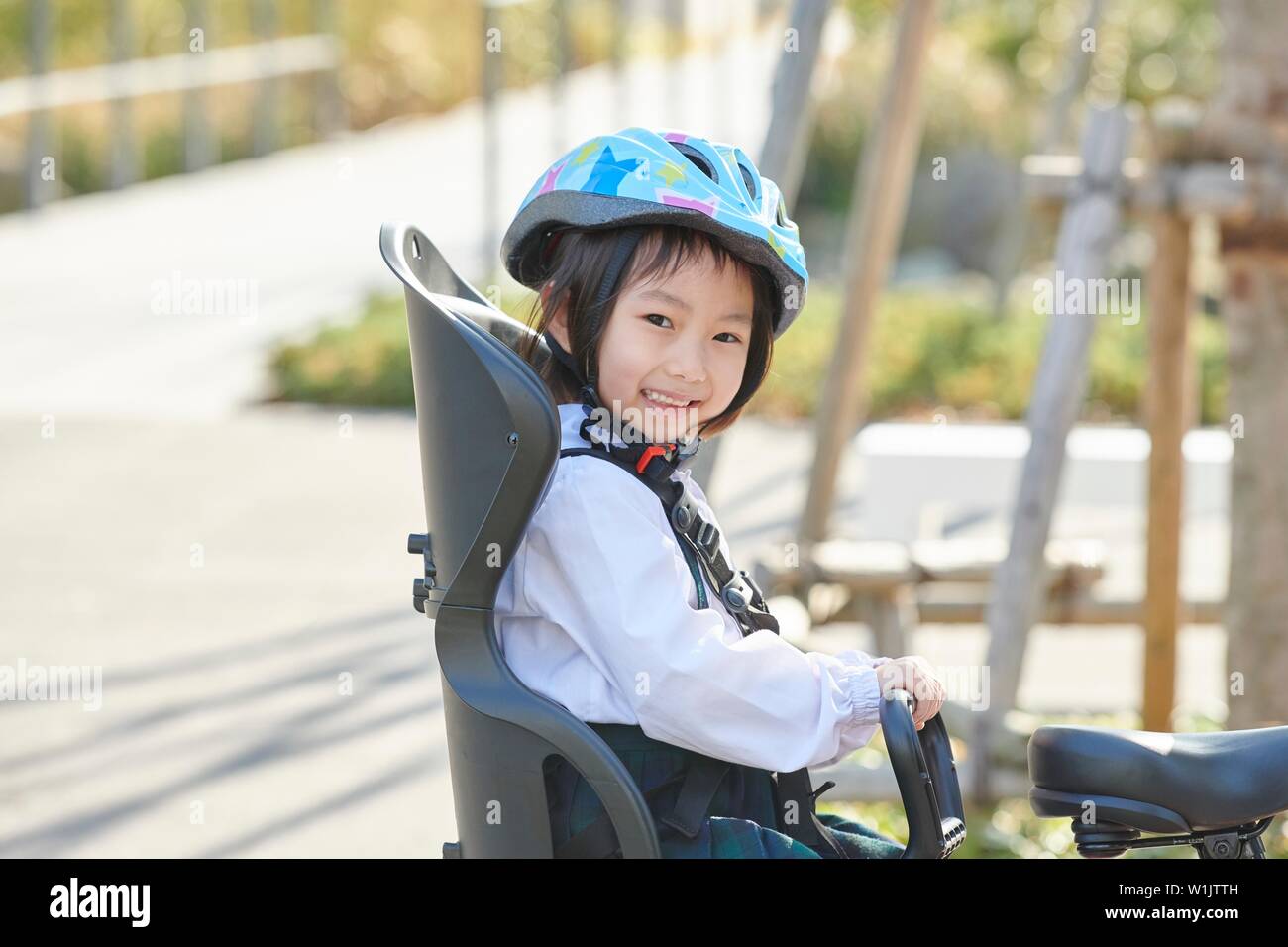 Japanese kid on a bike Stock Photo - Alamy