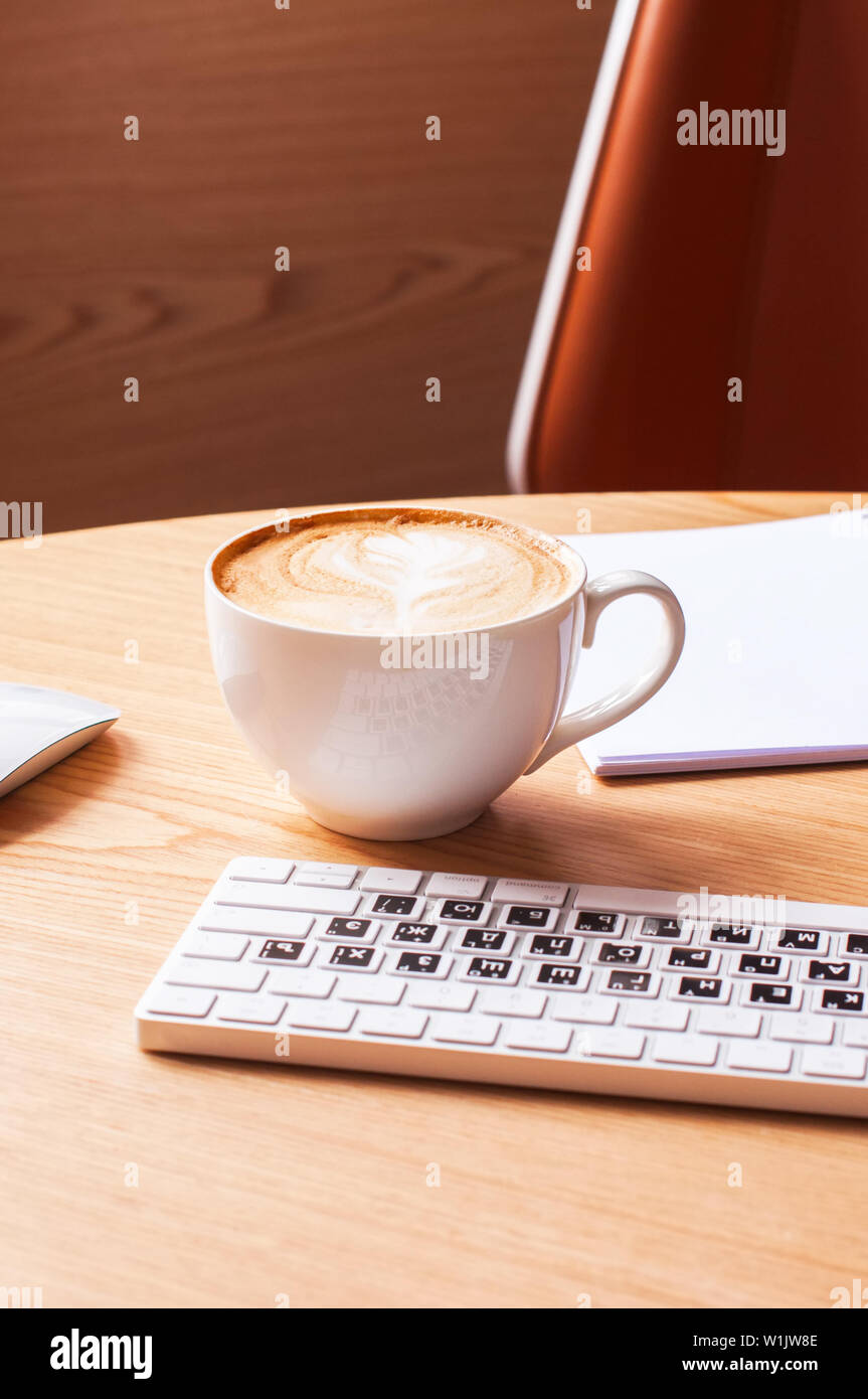 Working at a coffee table hi-res stock photography and images - Alamy