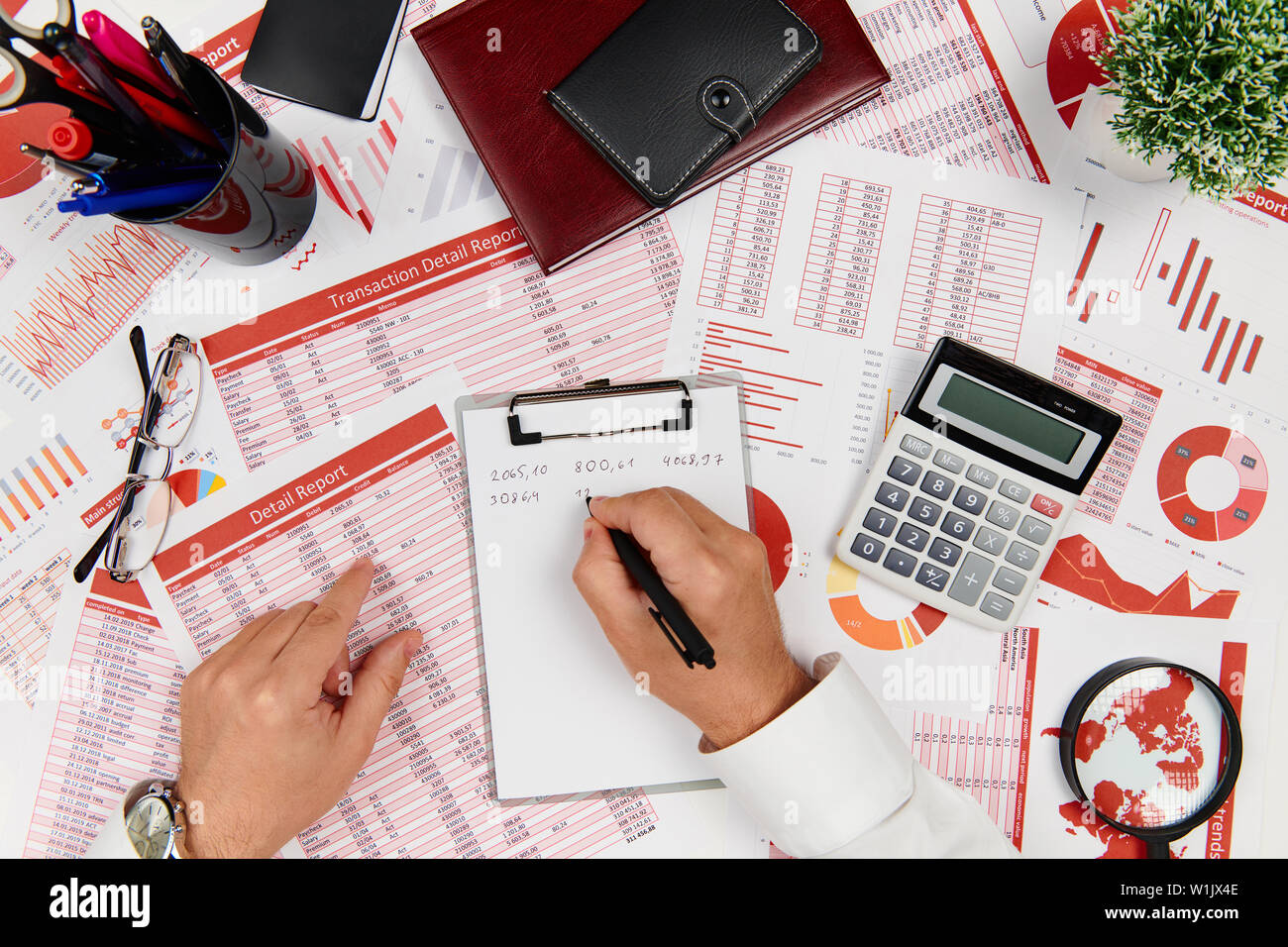 Business reports, data tables and charts - directly above view of ...