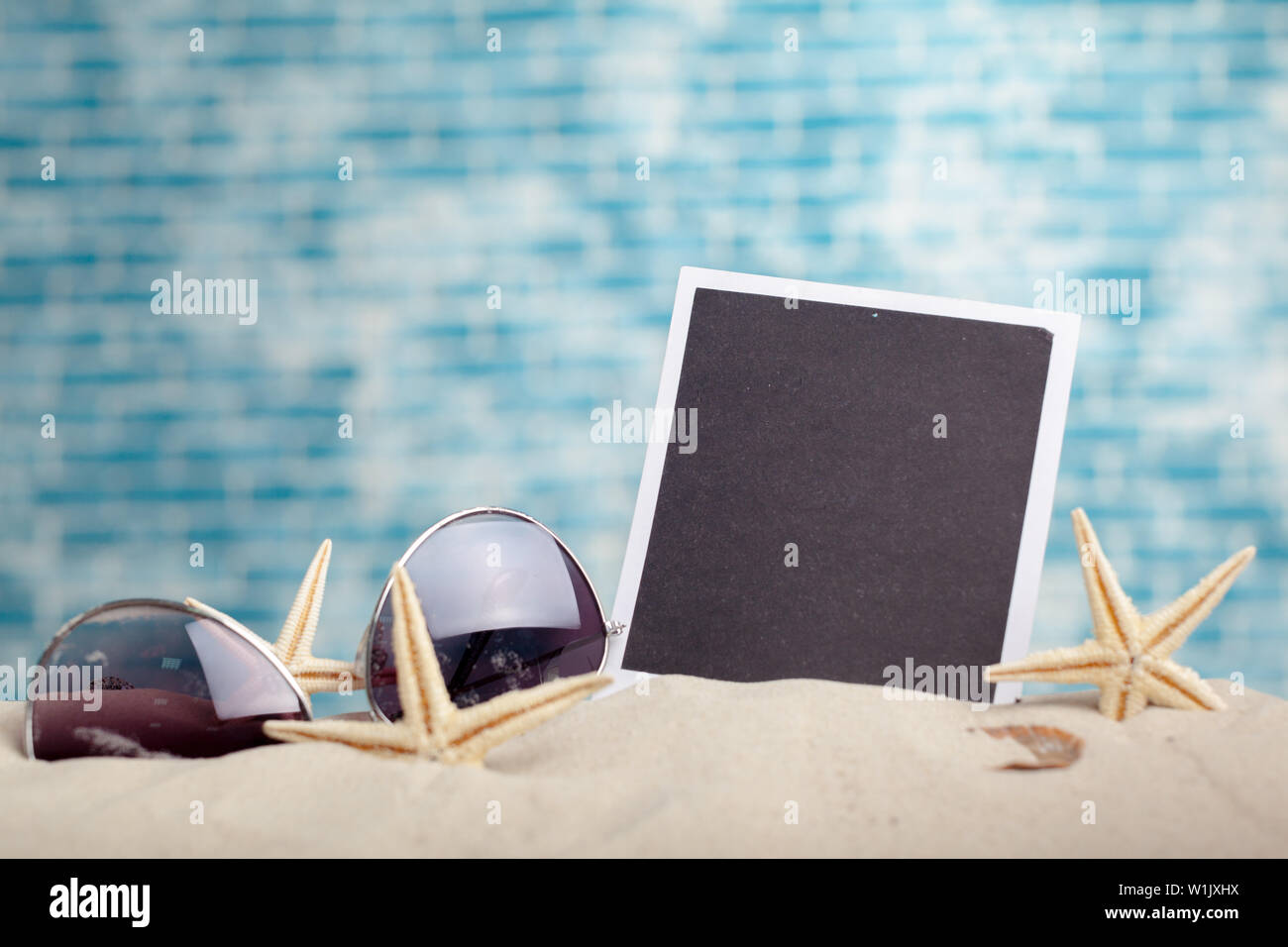 photo frames on the beach with seashells around Stock Photo - Alamy