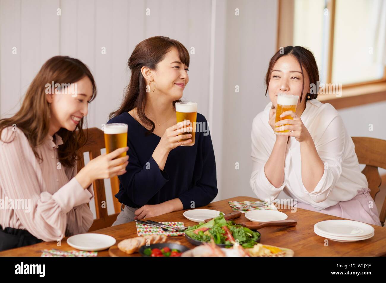 Japanese women having home party Stock Photo - Alamy