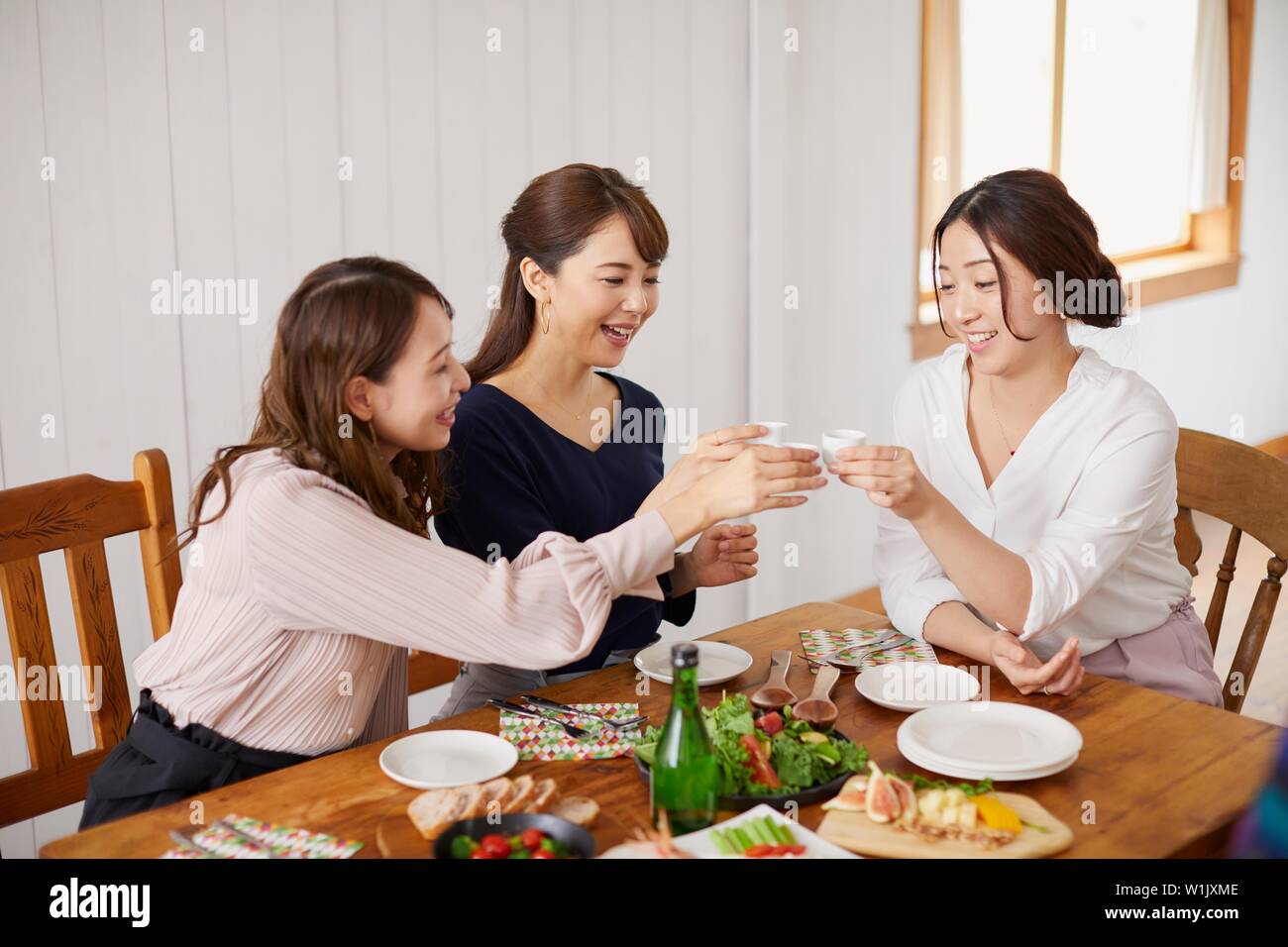 Japanese women having home party Stock Photo - Alamy