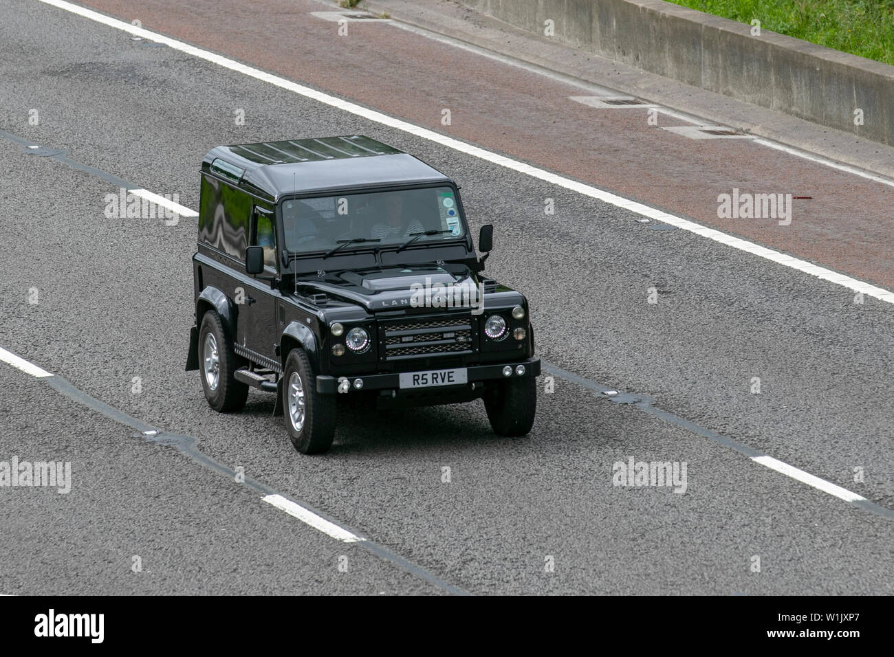2010 black Land Rover Defender 90 Hard TOP TD; M6, Lancaster, UK ...