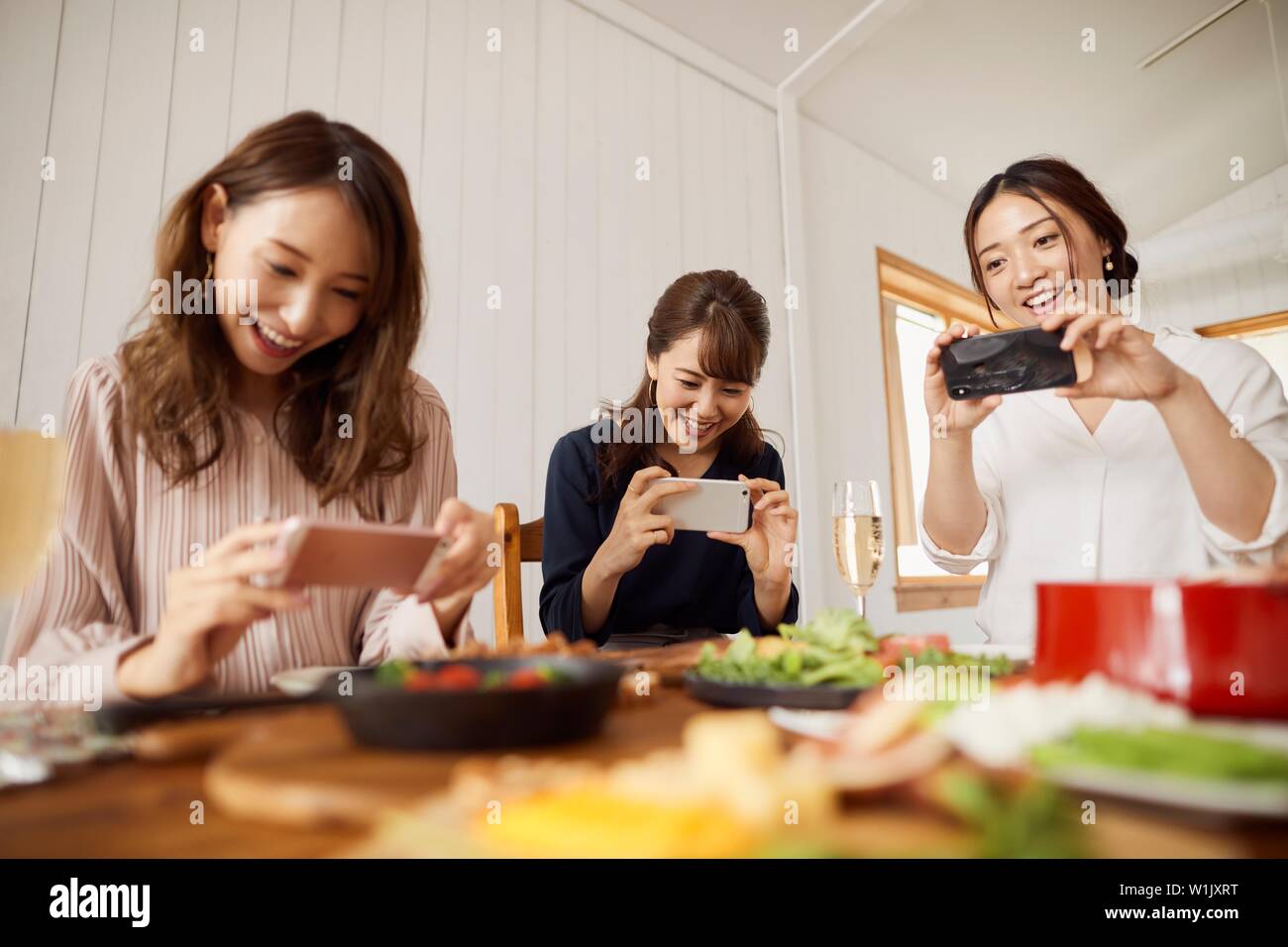 Japanese women having home party Stock Photo - Alamy