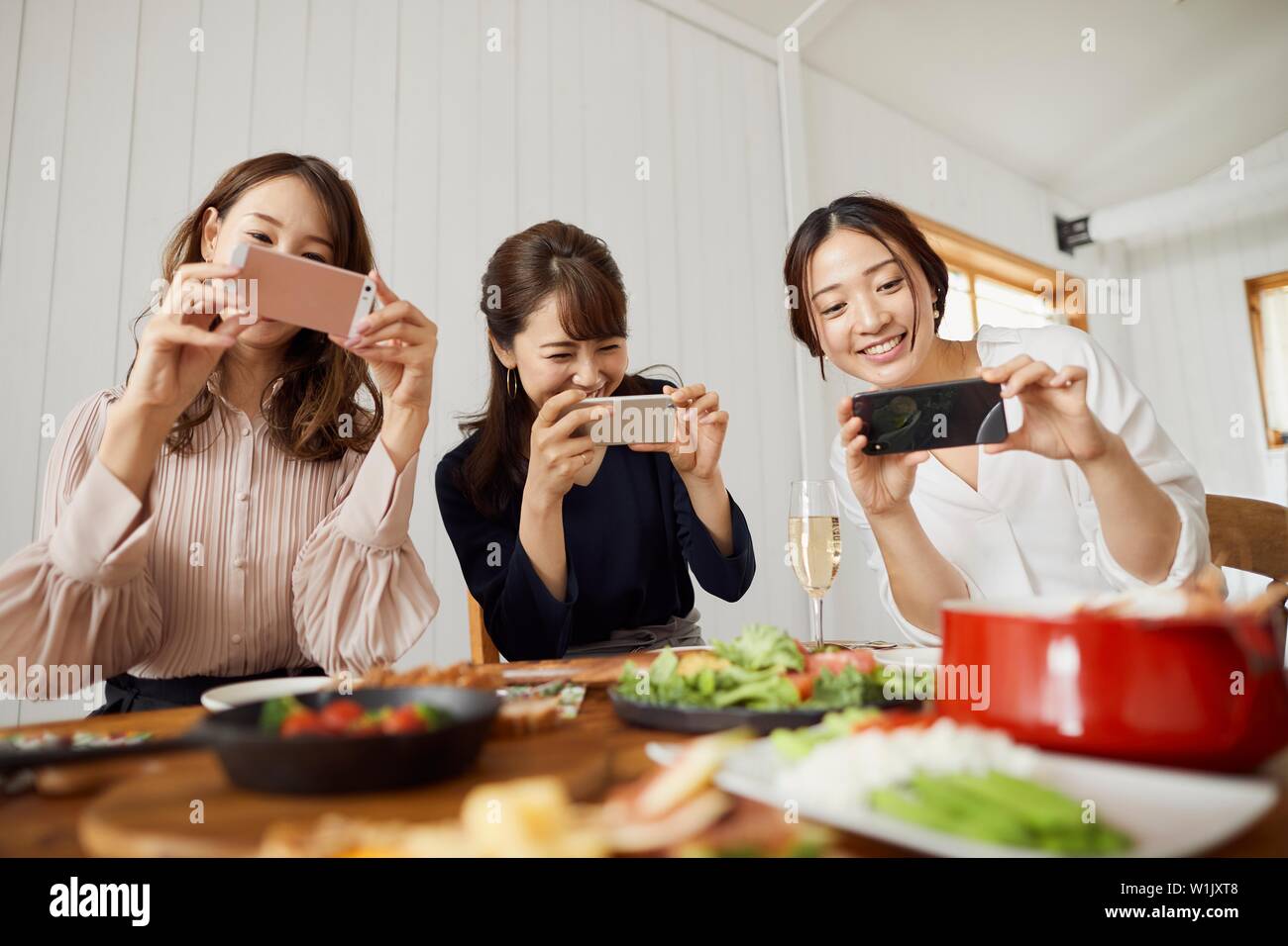 Japanese women having home party Stock Photo - Alamy