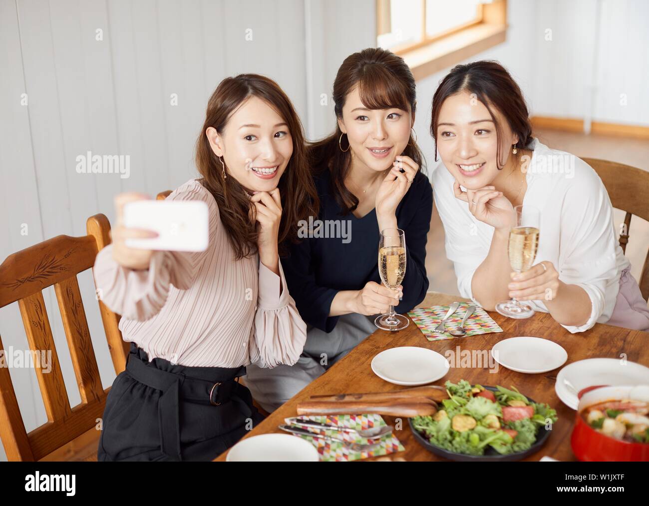 Japanese women having home party Stock Photo - Alamy
