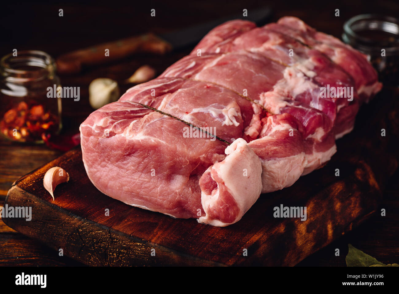 Pork loin joint with spices Stock Photo - Alamy
