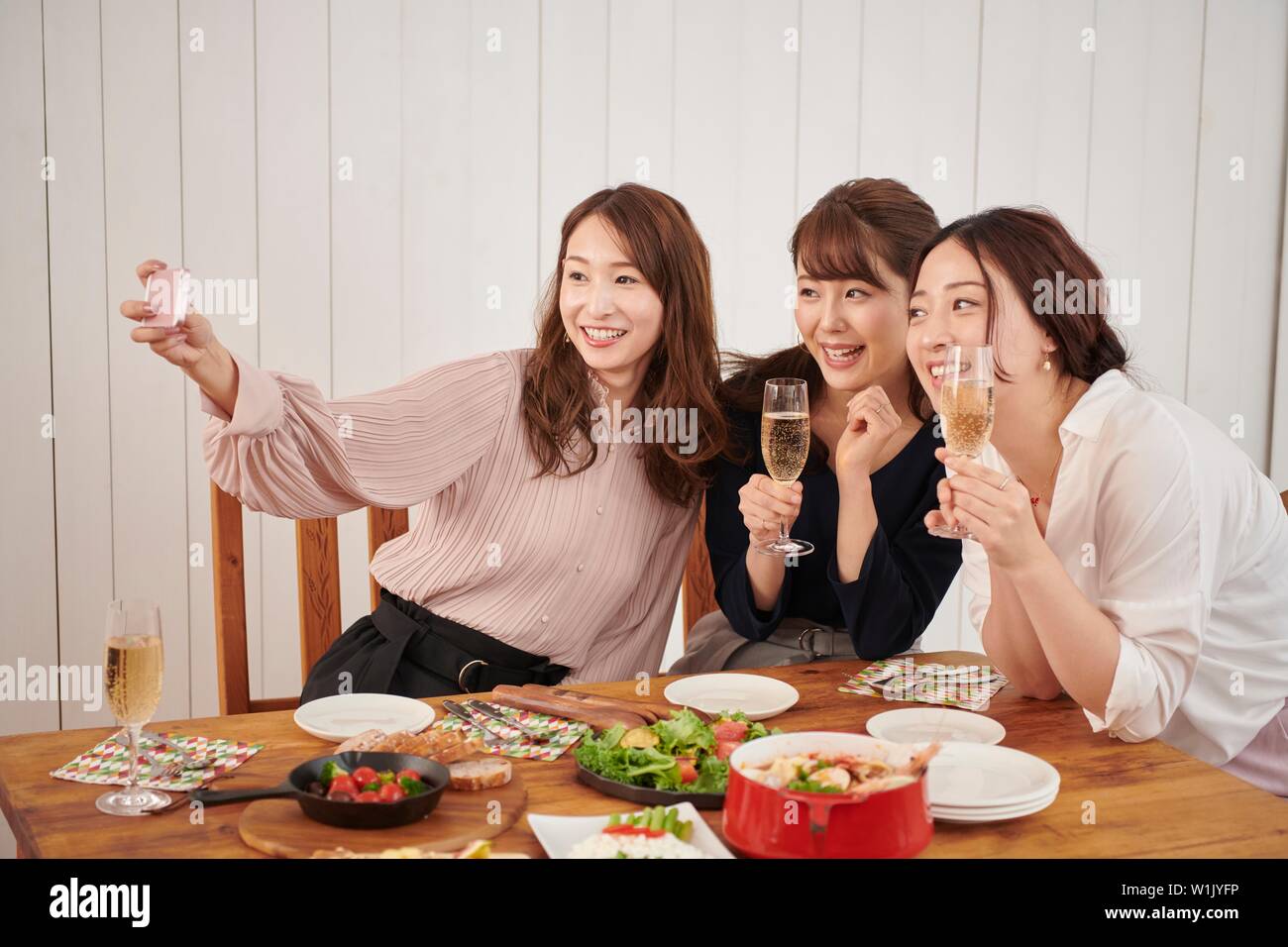Japanese women having home party Stock Photo - Alamy