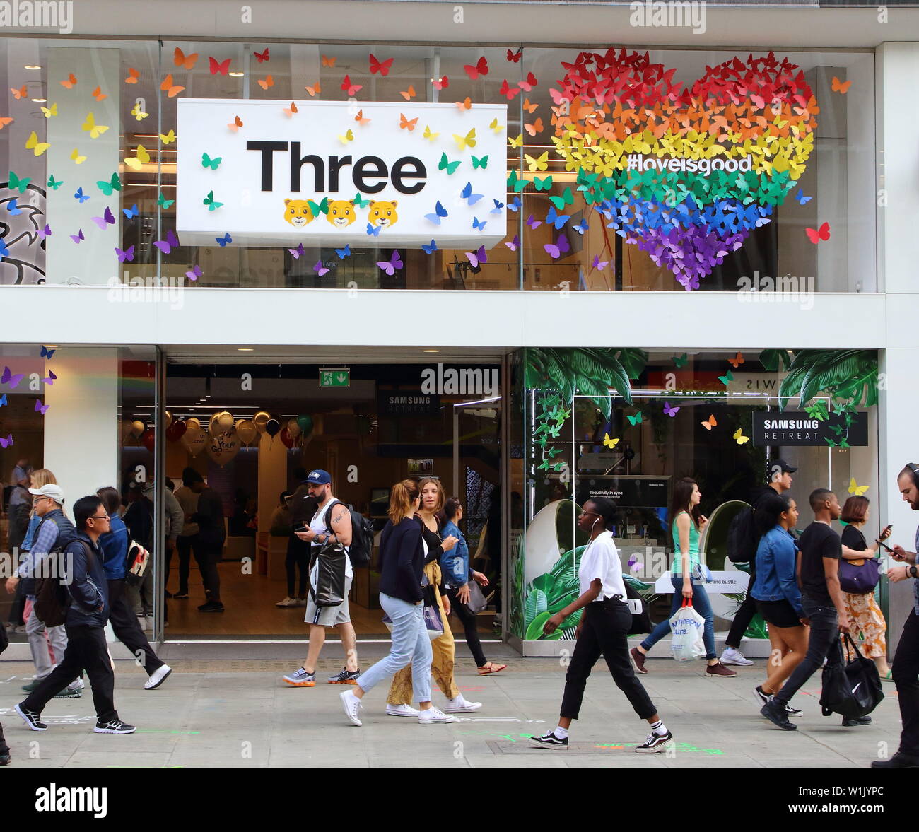 London, UK. 2nd July, 2019. Three store sign with rainbow heart display ...