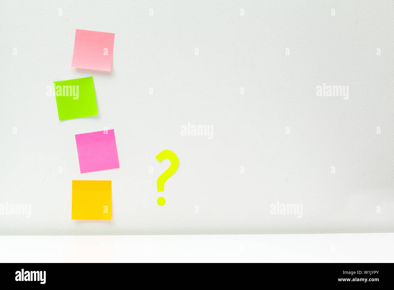 sticky notes with question marks over white Stock Photo - Alamy
