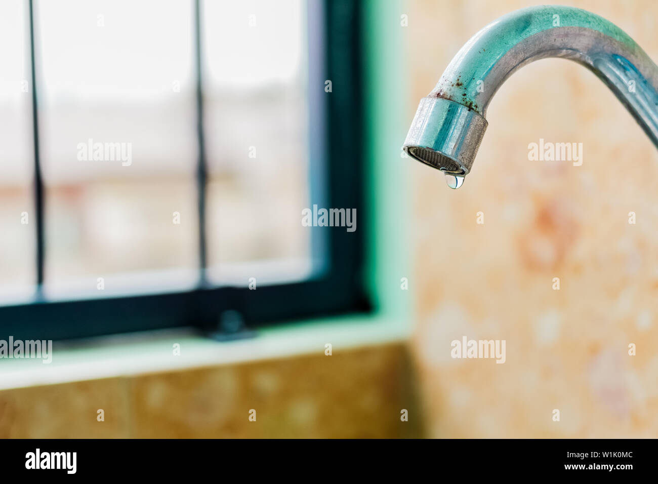 old rusty tap leaking water Stock Photo - Alamy