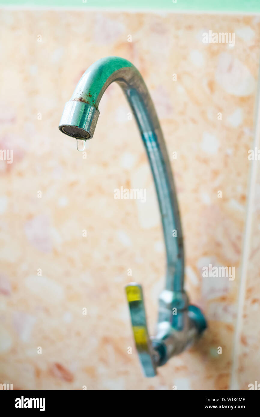 old rusty tap leaking water Stock Photo - Alamy