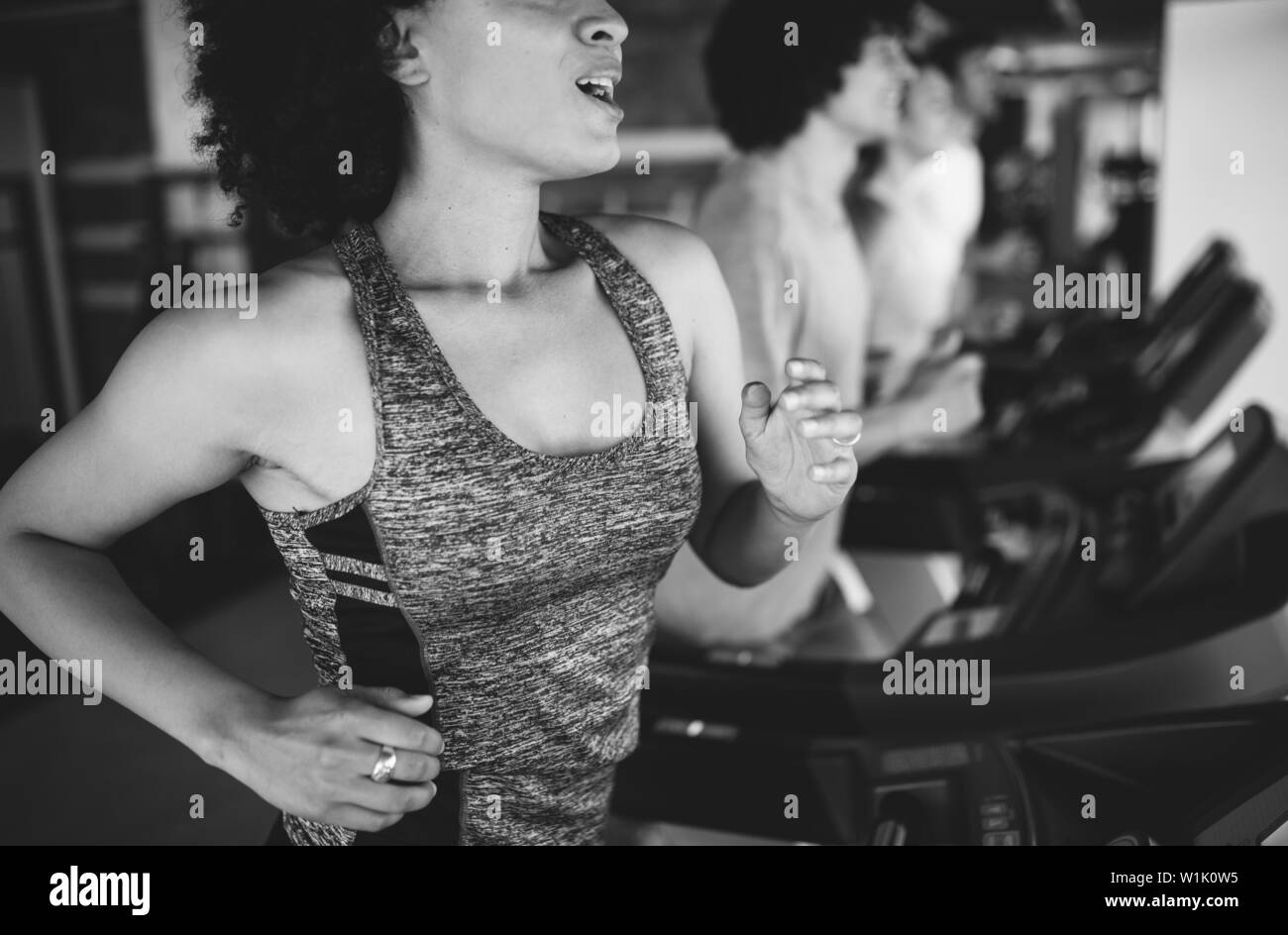 Beautiful fit people exercising together in gym Stock Photo - Alamy