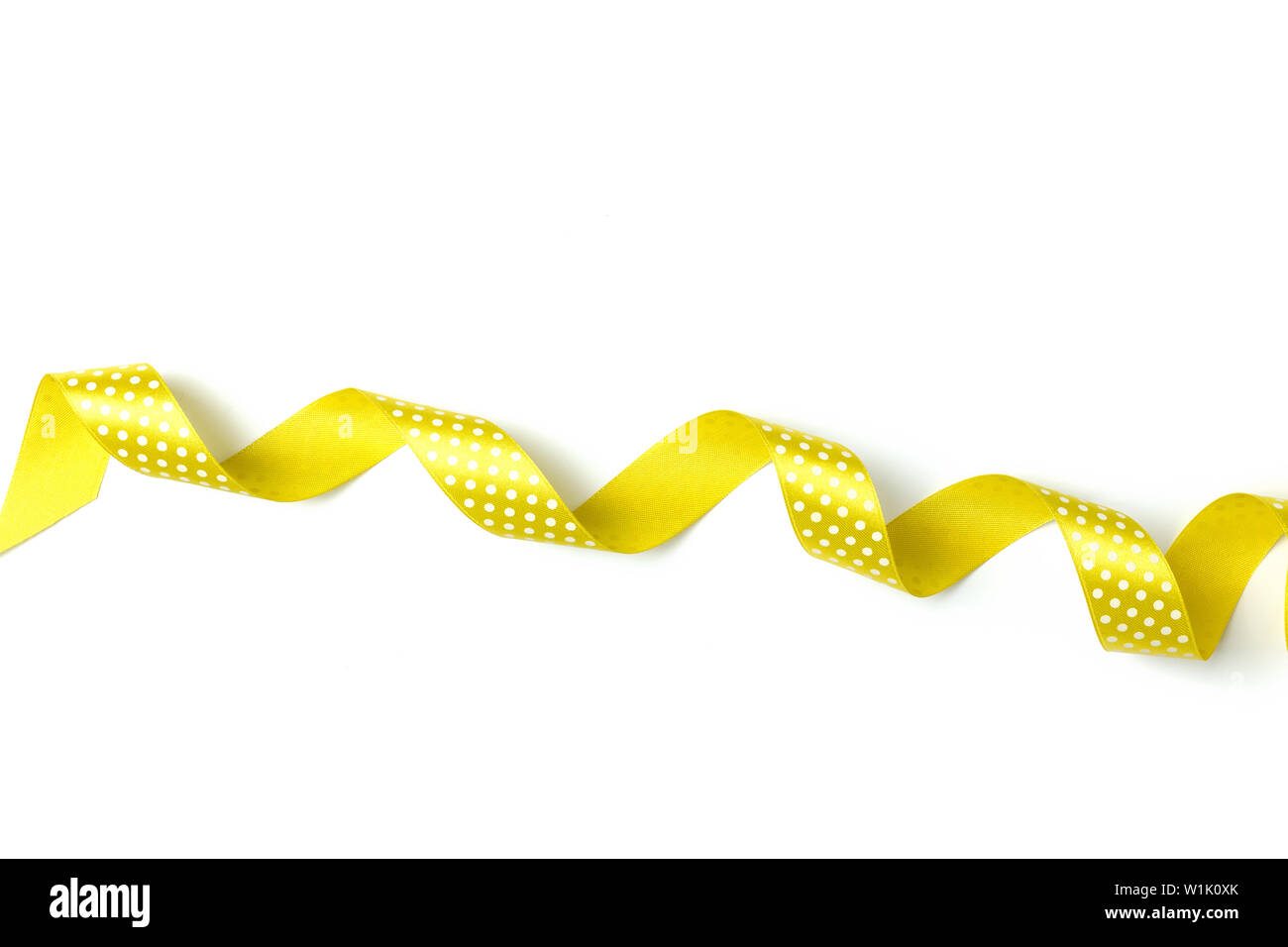 Yellow ribbons isolated on white Stock Photo - Alamy